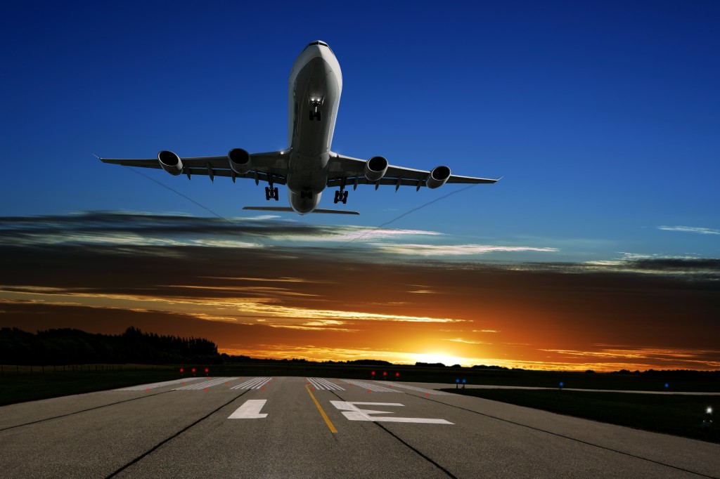 com plane landing sunset - Alta Data Technologies